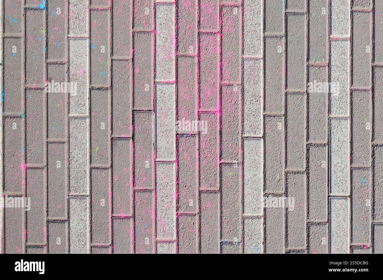Multi colored earth, paving slabs, powder coated with dry colors at the ...