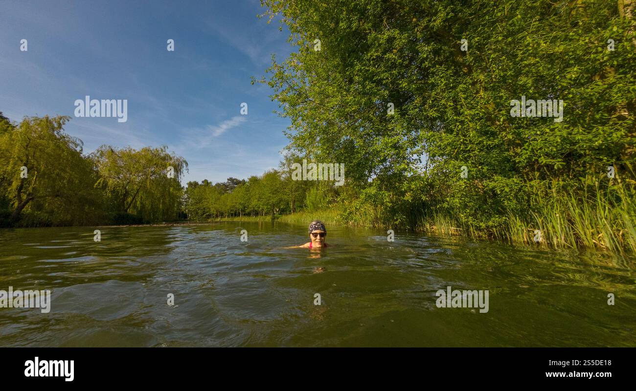 Caucasian female wild Swimming in the Monet Lake at Pool Bridge Farm ...