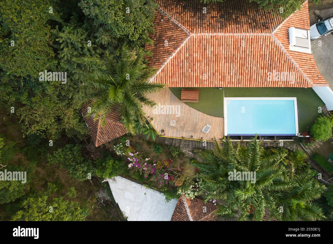 Terrace with swimming pool in green nature background aerial drone top ...
