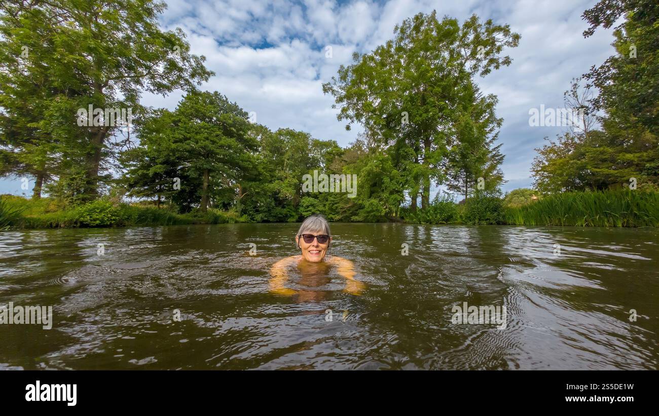 Female wild swimmer at Chaloner Pond. York Stock Photo - Alamy
