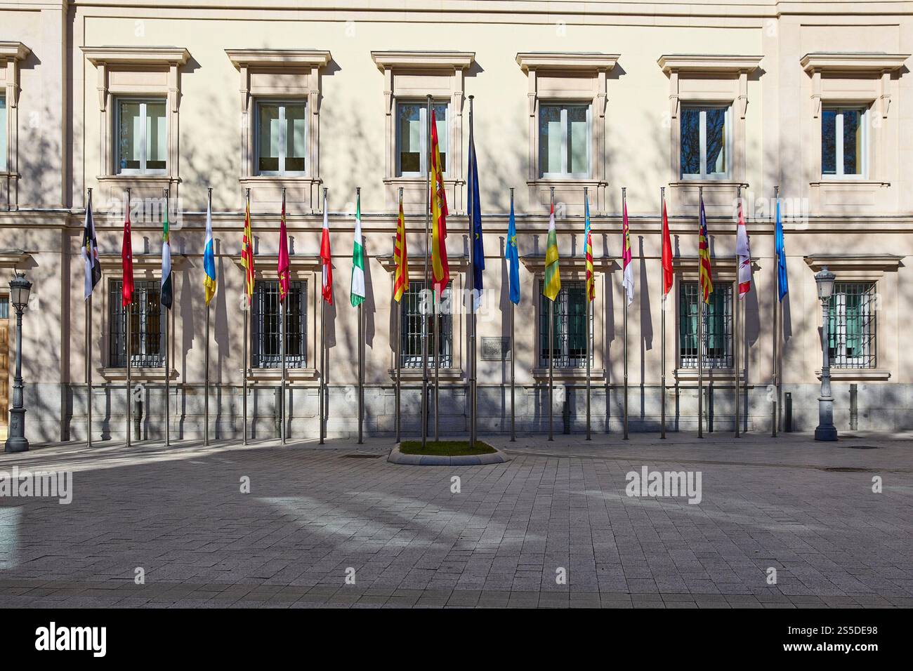 Flags of the Autonomous Communities in front of the façade of the ...