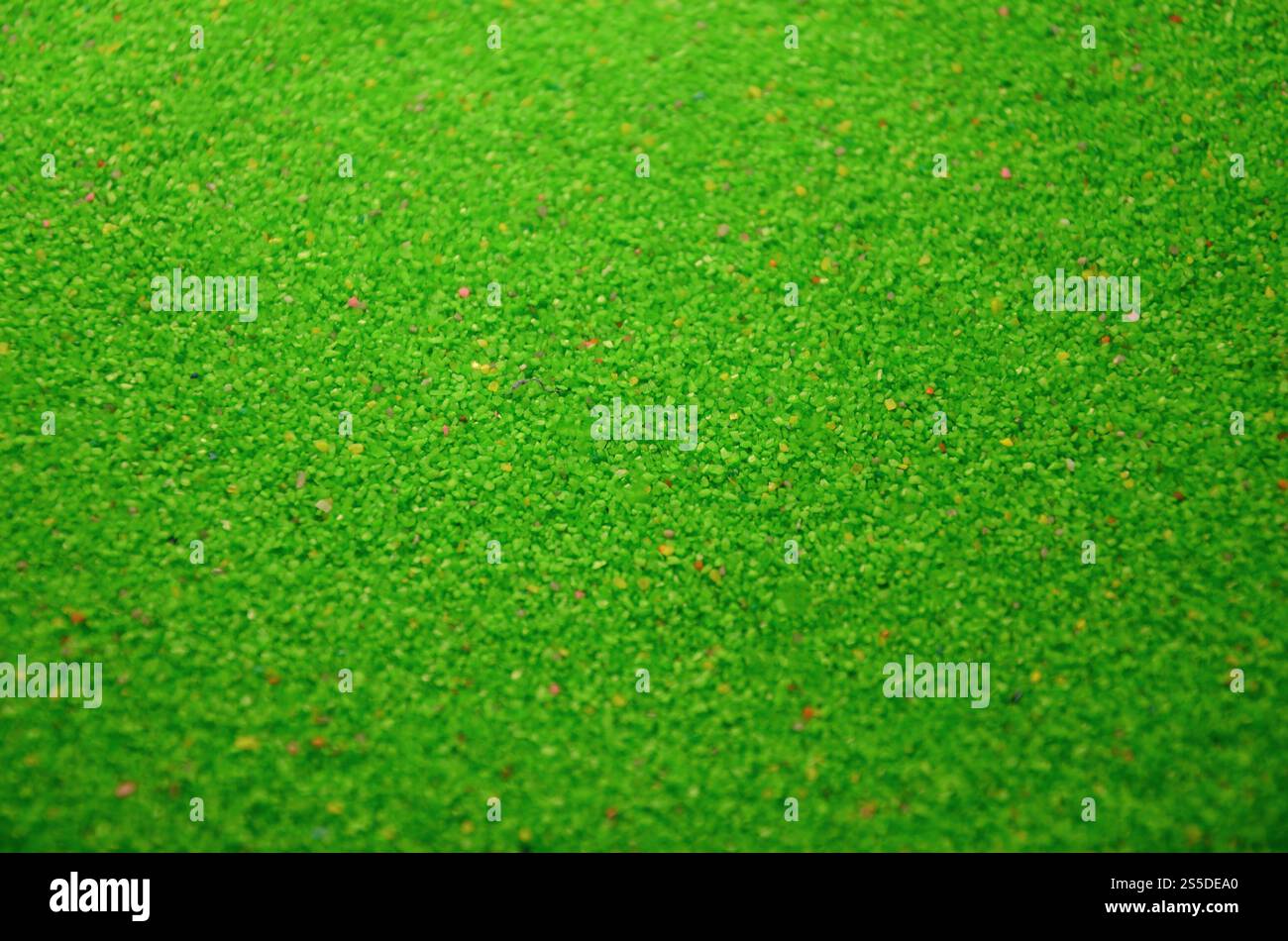 Texture of a colored granular sand close up. Green grains Stock Photo ...