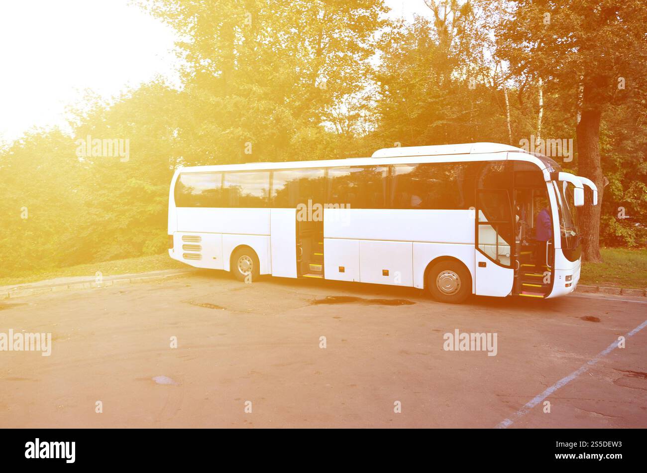 White tourist bus for excursions. The bus is parked in a parking lot ...