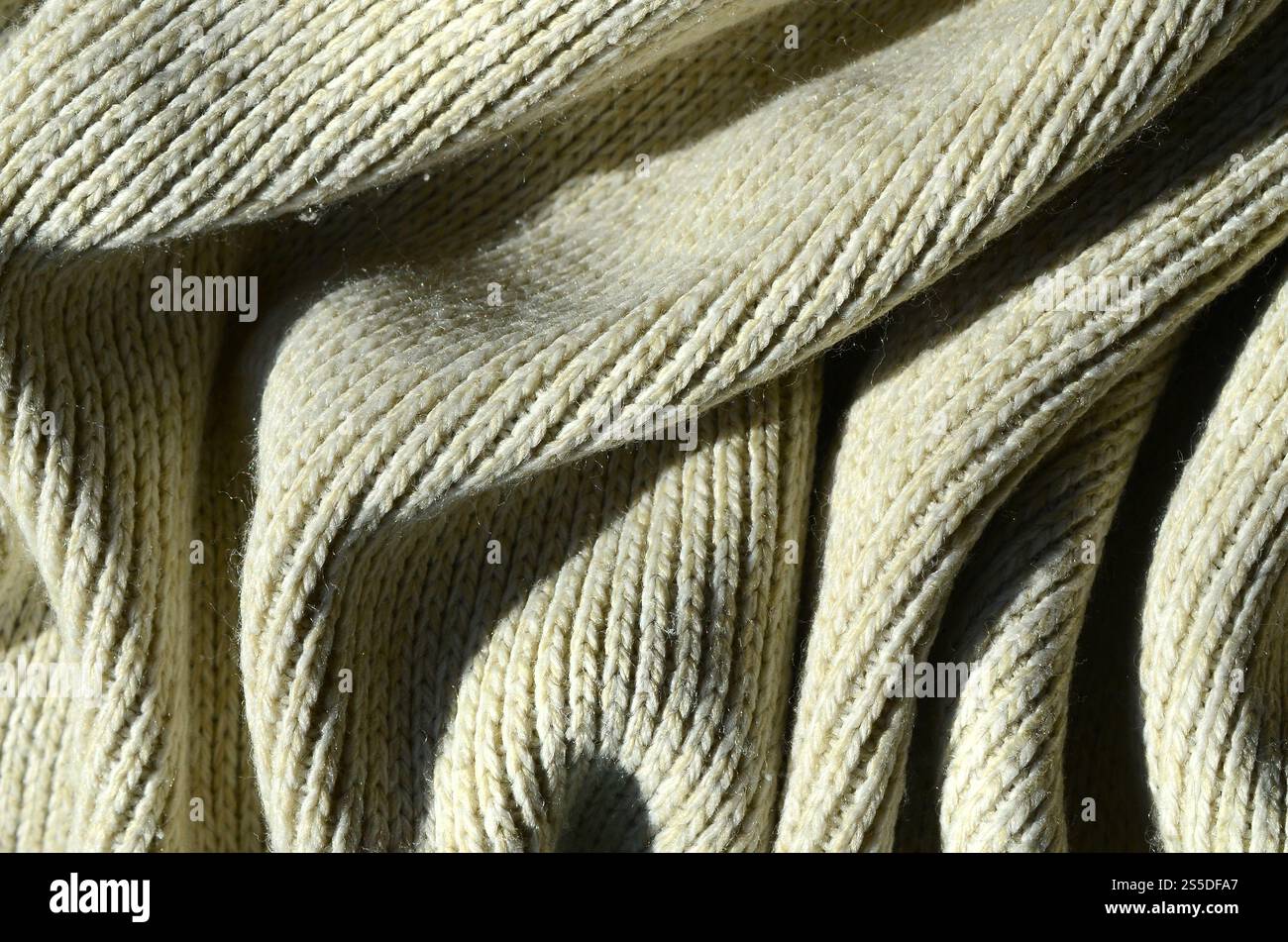 Fabric texture of a soft yellow knitted sweater. Macro image of the ...