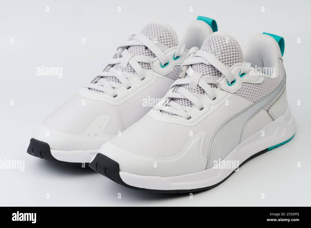 Stylish white sport shoes perspective front view isolated Stock Photo ...