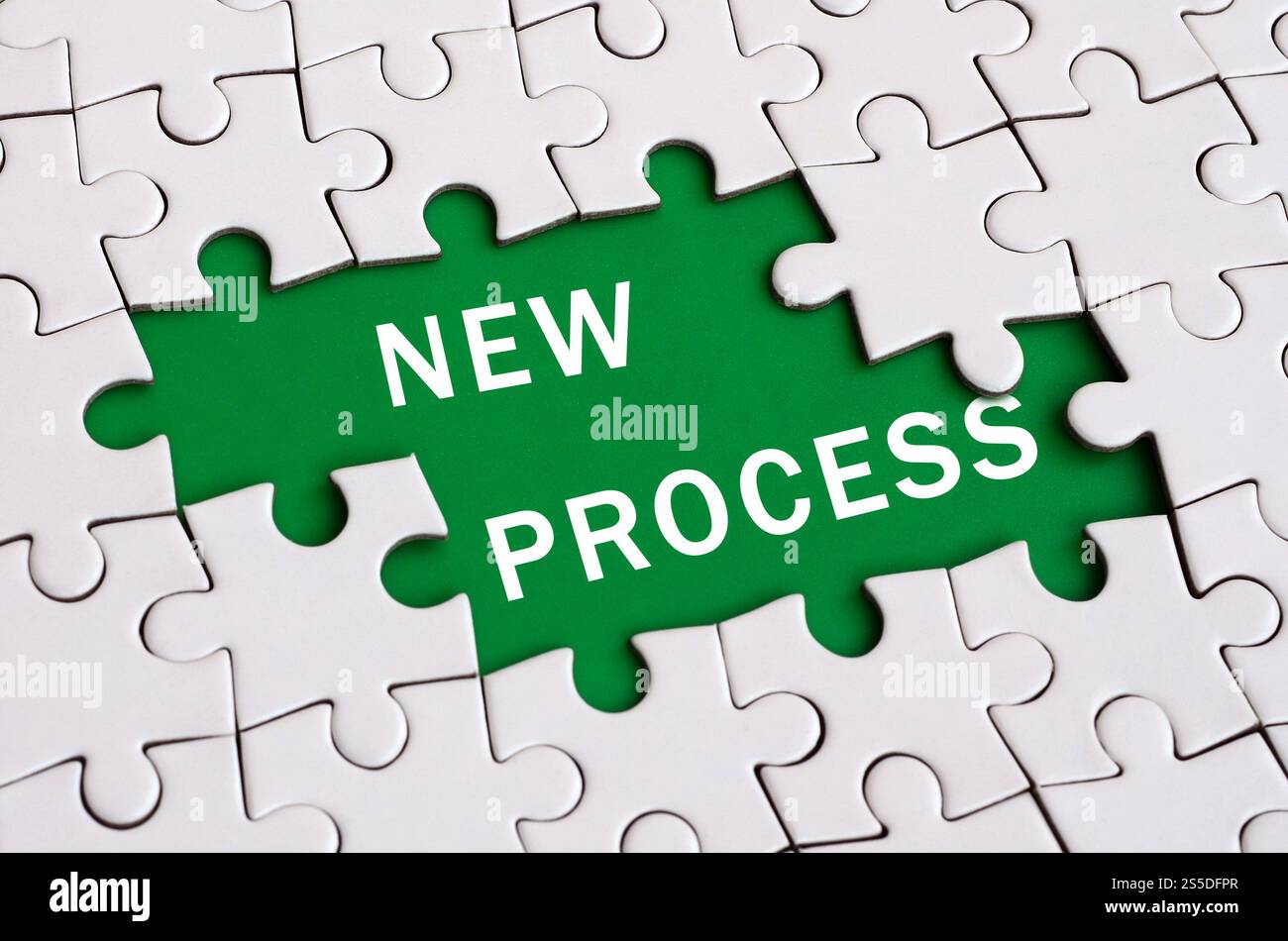 White jigsaw puzzle in assembled state with missing elements forming a ...