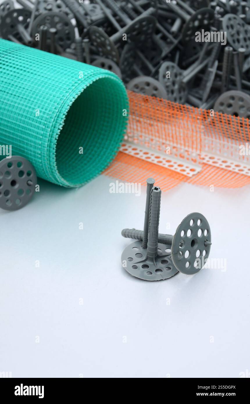 A set of construction items for the insulation of walls. Plastic dowels ...