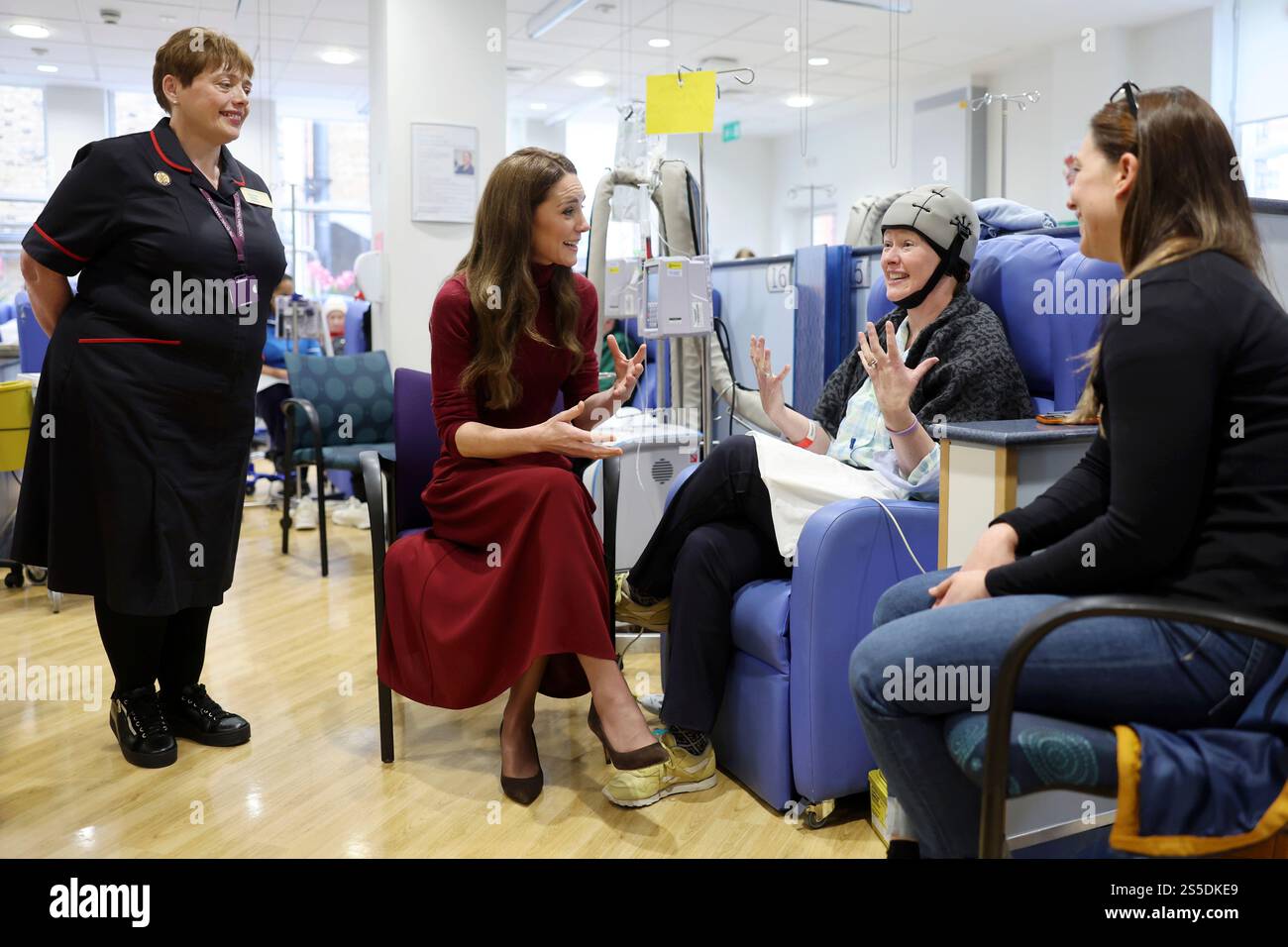 Britain's Princess Kate, centre left, talks with Katherine Field ...