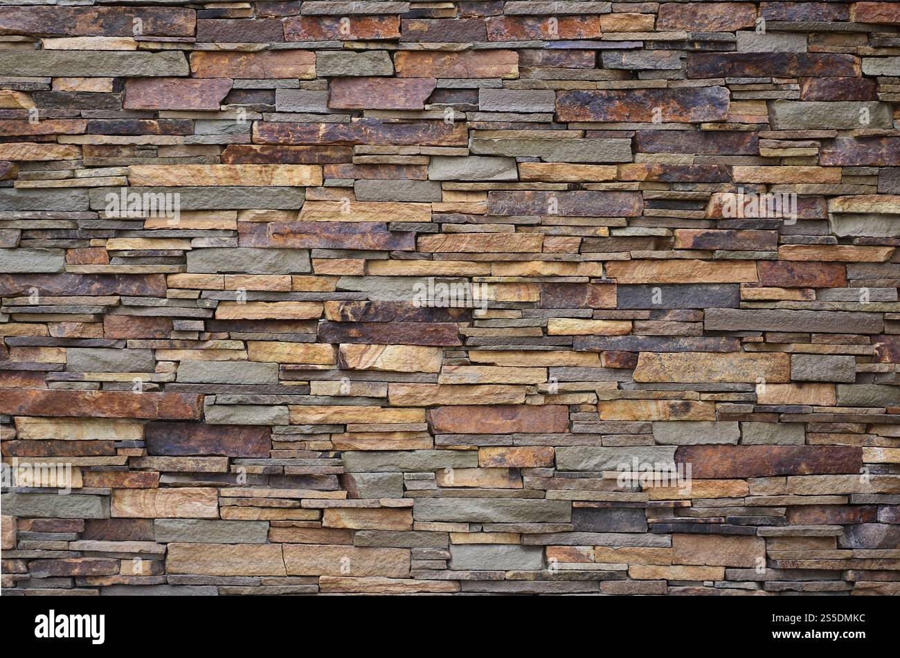 Texture of a stone wall from long and rough stones of different sizes ...