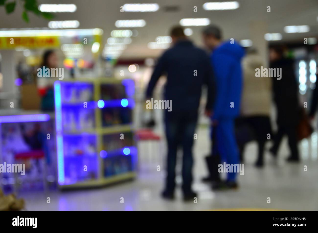 Defocused image of the interior spacious trading hall with a mass of ...