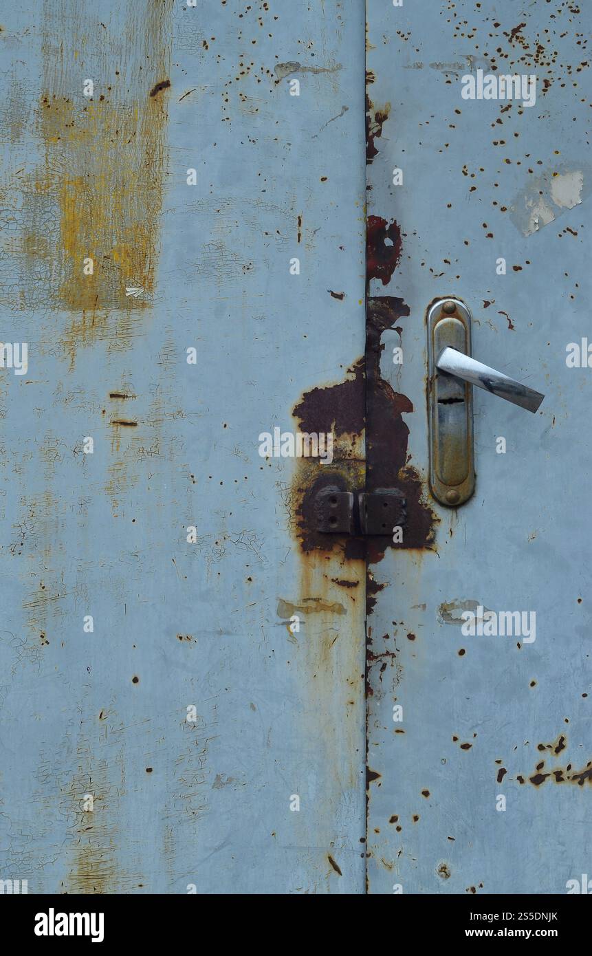 The texture of the metal surface from the outer old door with a ...