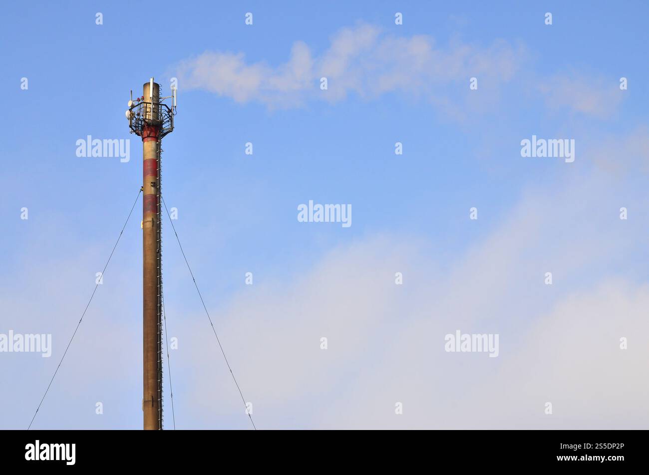 Chimney steam pipe of industrial manufacturing plant. High chimney of ...