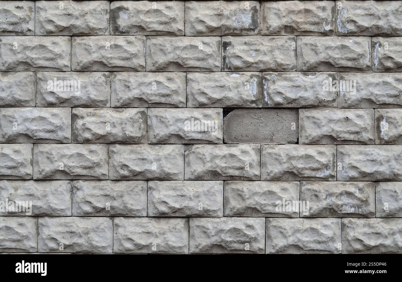 Weathered stained old block wall background. Texture of an old wall of ...