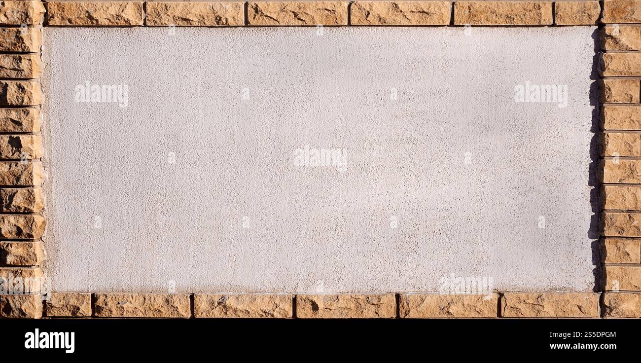 Frame made of masonry. Brick frame around the clean and light concrete ...