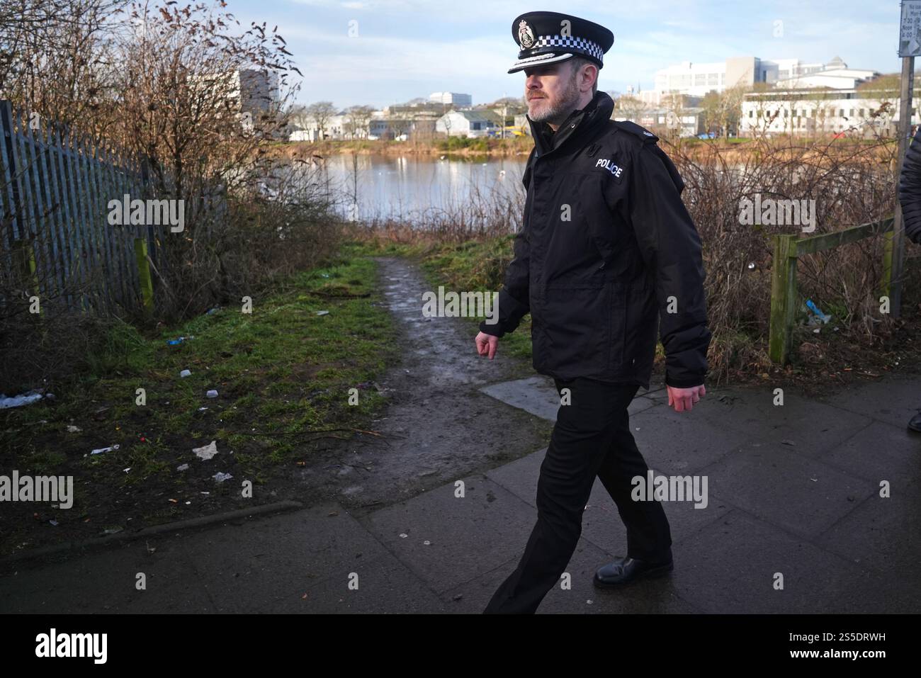 Police Scotland's Superintendent David Howieson walks past the path ...