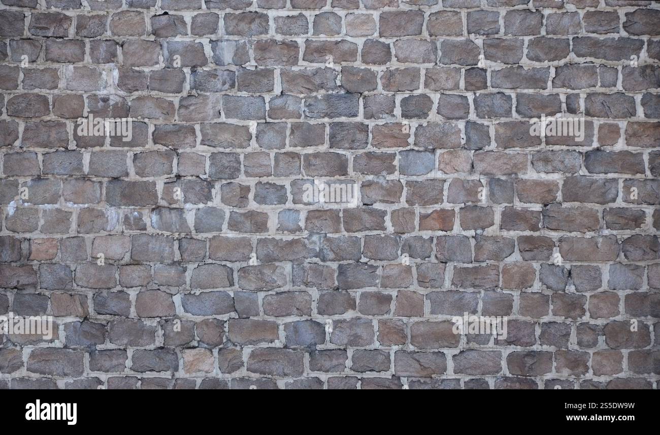 Weathered stained old block wall background. Texture of an old wall of ...