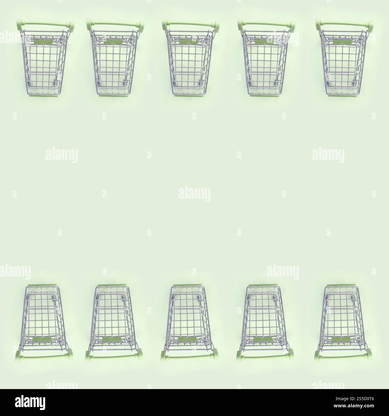 Pattern of many small shopping carts on a lime background. Minimalism ...