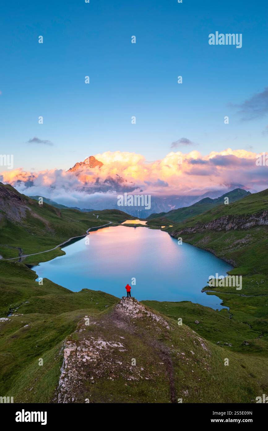 Aerial view of a person admiring the Bachalpsee lake during a summer ...