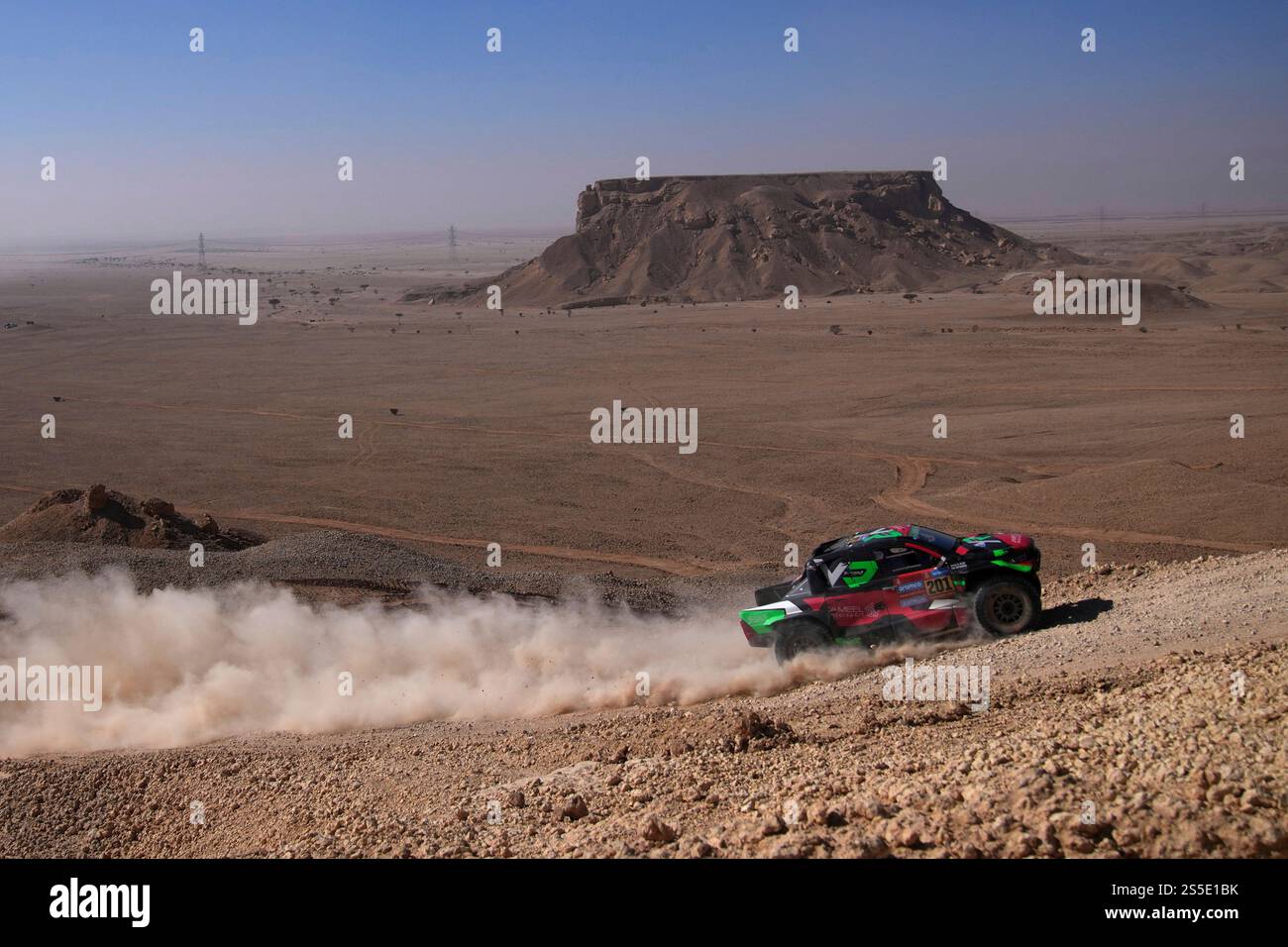 Driver Yazeed Al Rajhi and co-driver Timo Gottschalk compete during the ...