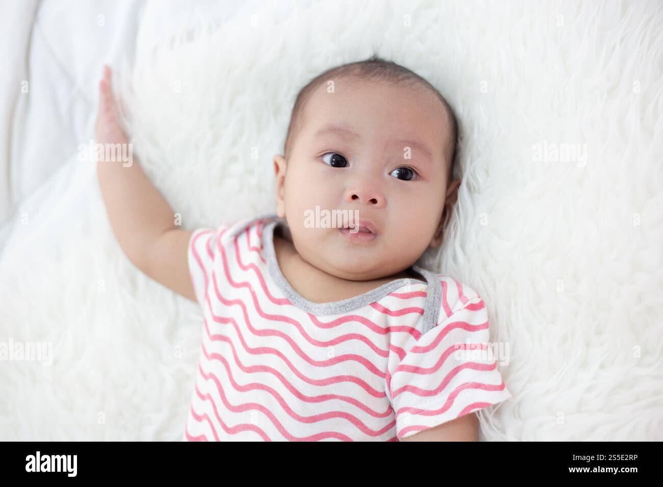 Asian baby on bed hi-res stock photography and images - Alamy