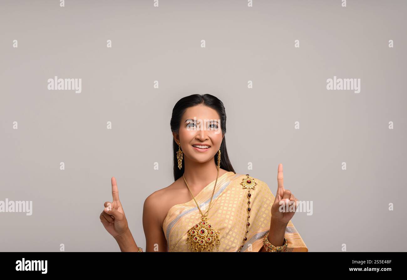 Women wearing Thai costumes that are symbolic, pointing fingers Stock ...