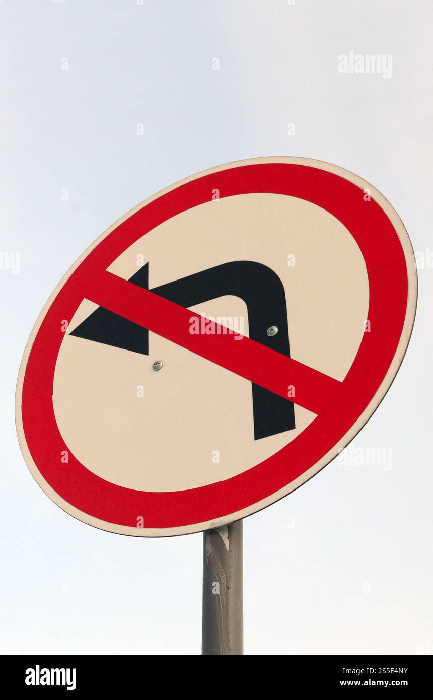 Turn left is prohibited. Traffic sign with crossed out arrow to the ...