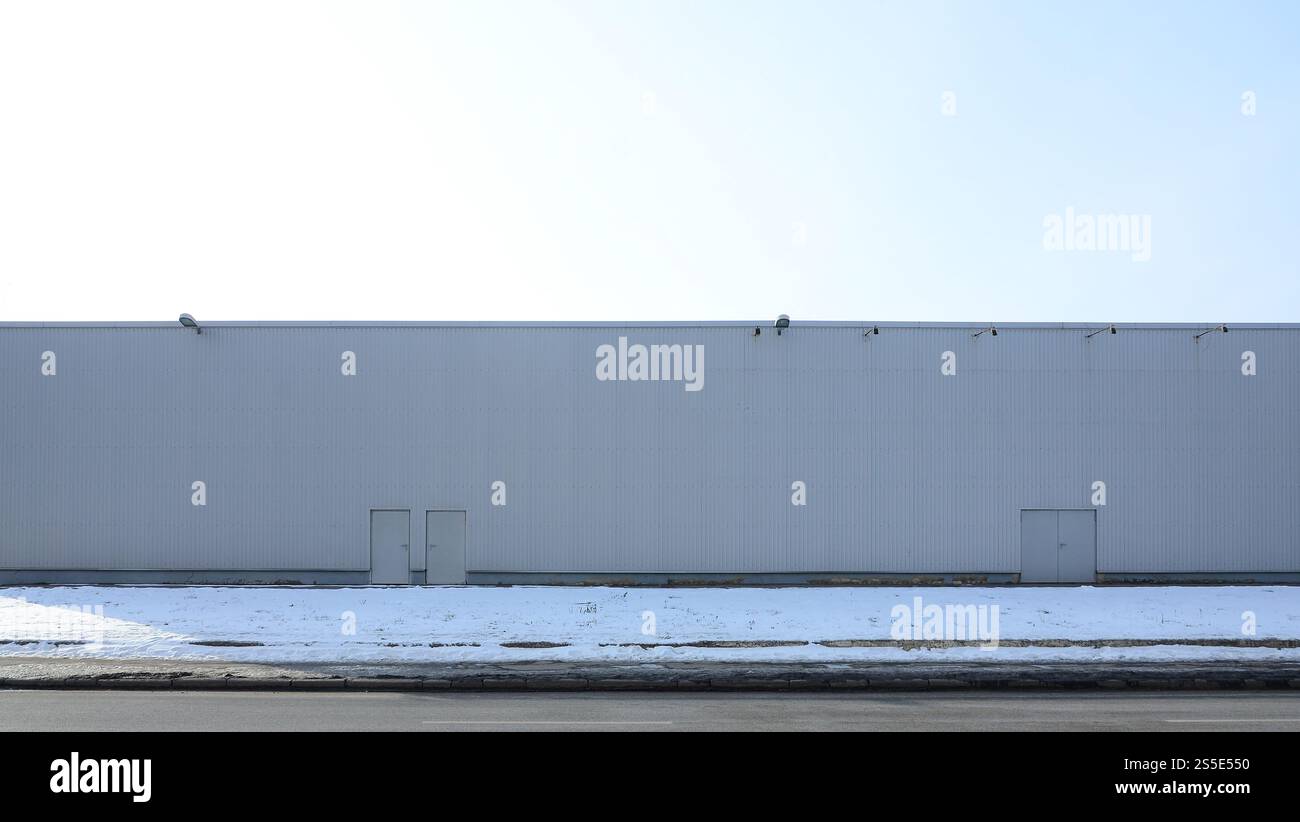 Texture of a high metal wall of an industrial building without windows ...