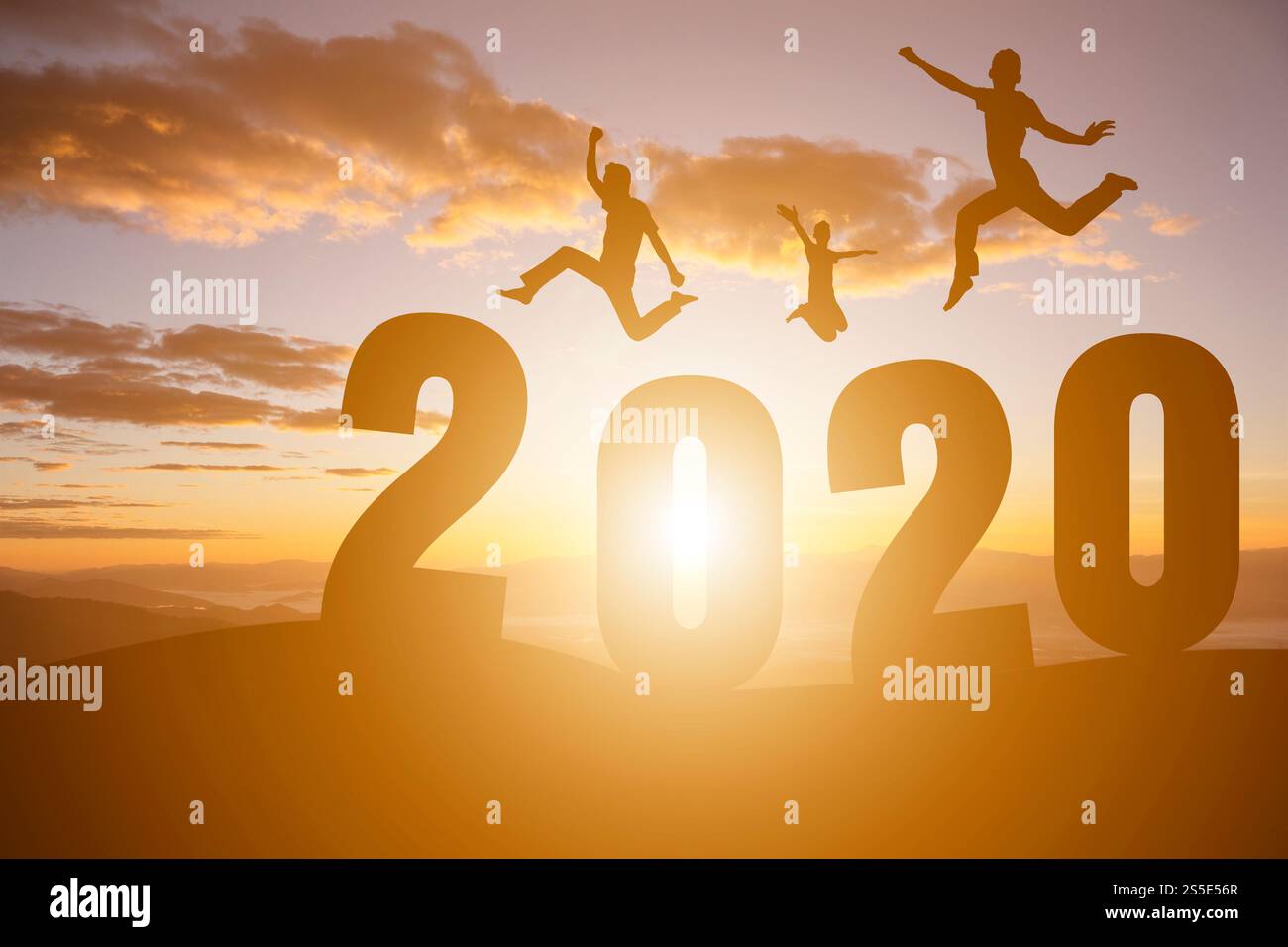 silhouette number 2020 and people jump on sunset background Stock Photo ...
