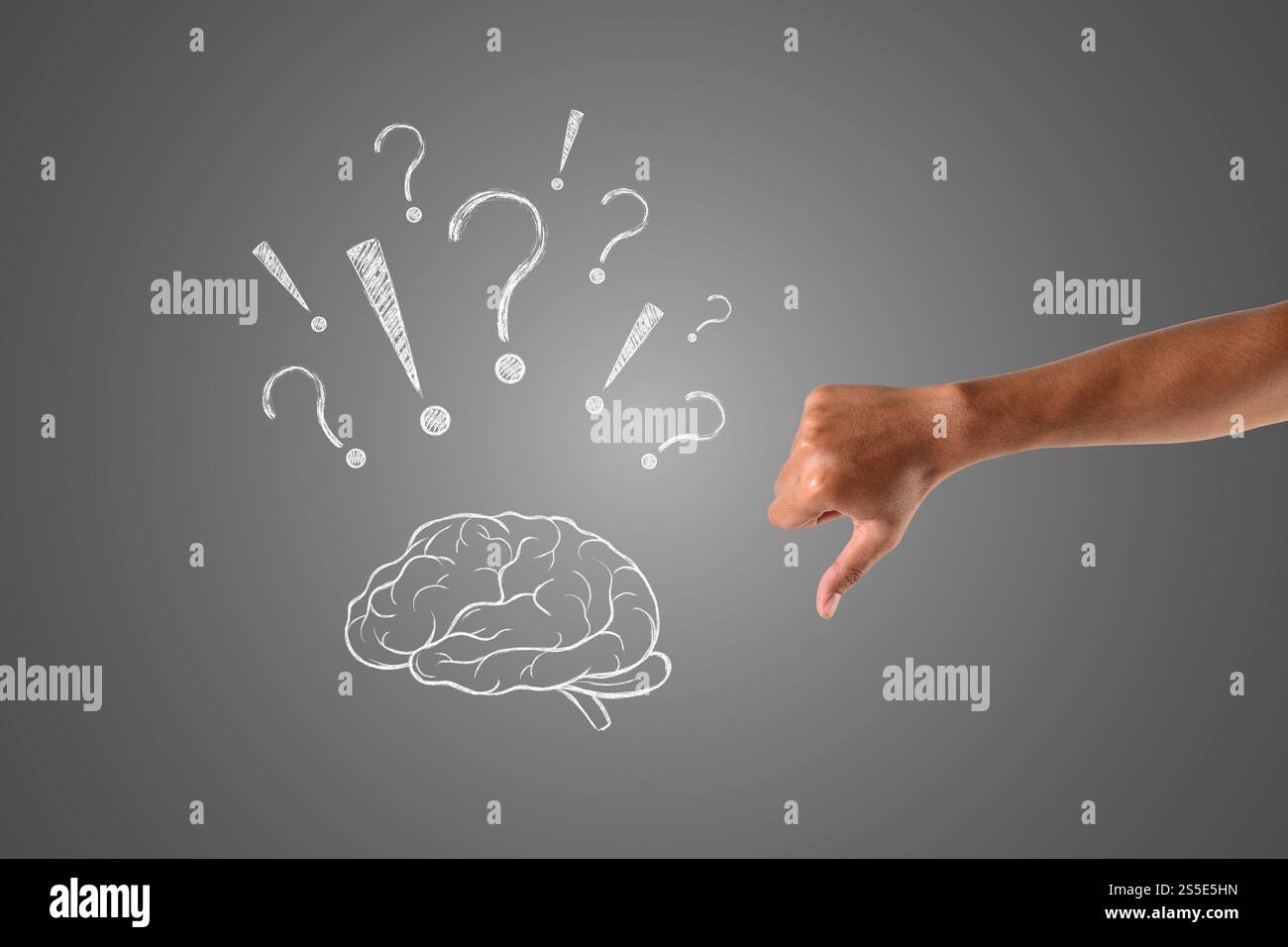 The brain with many questions painted in white chalk and The thumb ...