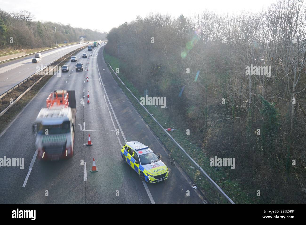 A police cordon blocking the inside lane of the northbound carriageway ...