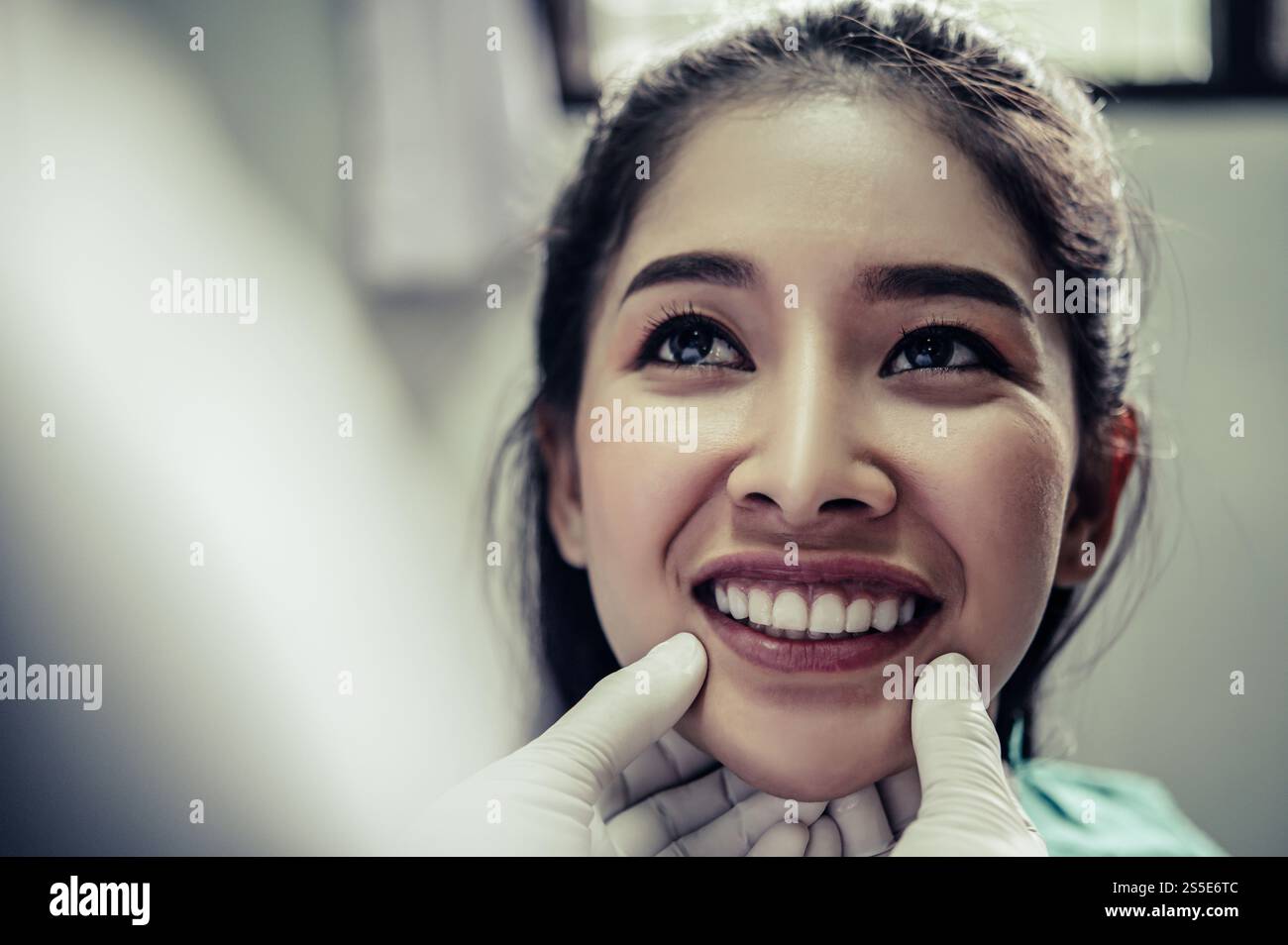 Dentist examines patient hi-res stock photography and images - Alamy