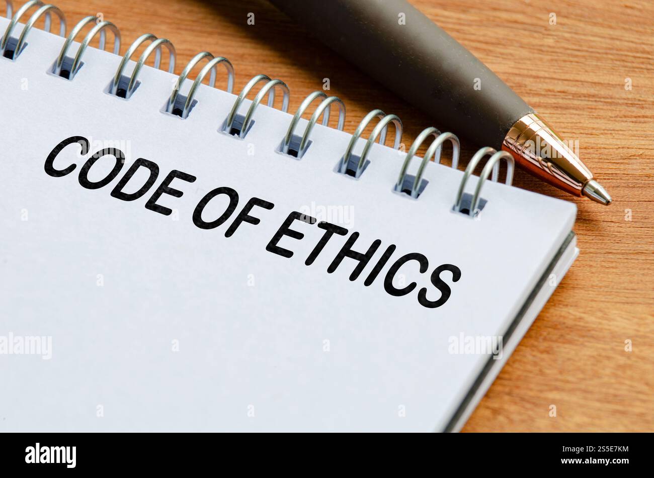 Code of ethics text on white notepad. Business code of ethics concept ...
