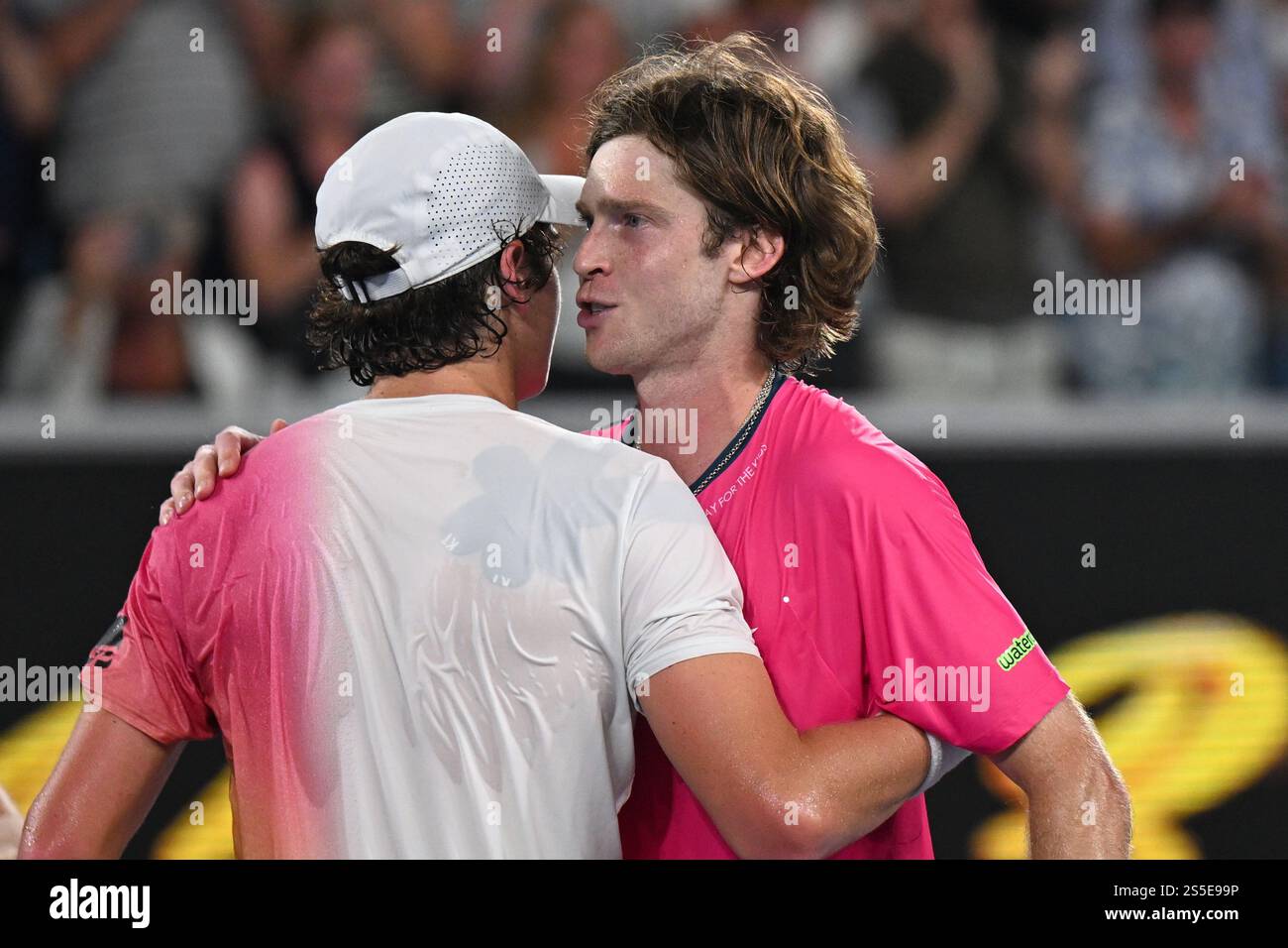 Joao Fonseca of Brazil speaks to Andrey Rublev of Russia after winning their round 1 match ...