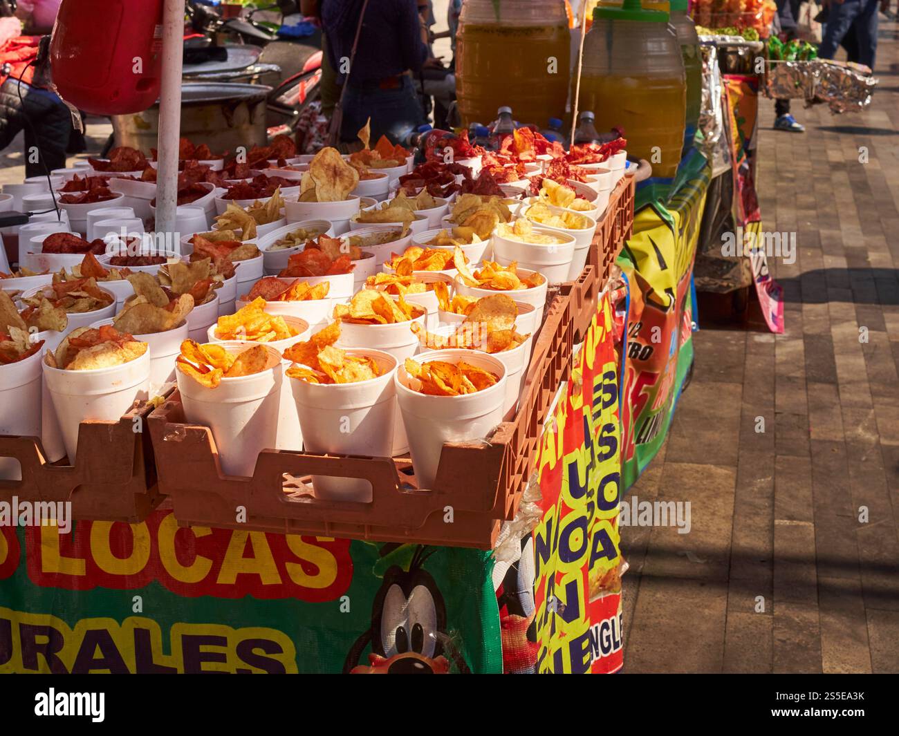 A street vendor selling bags of highly spiced potato chips. Mexico City ...