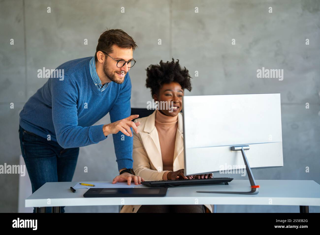 Mixed team of software engineers brainstorming ideas. Diverse app developers collaborating as ...