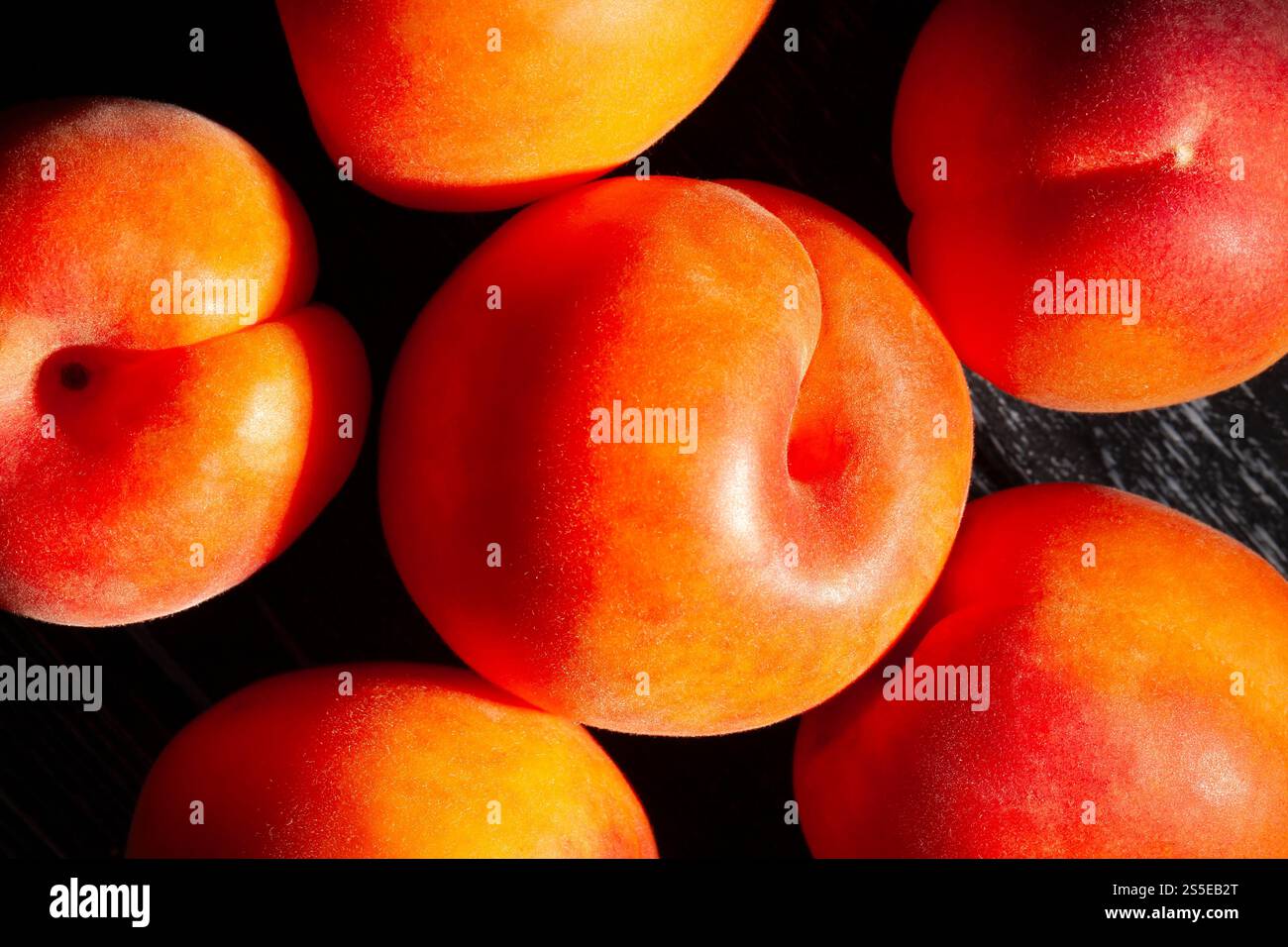 Apricot on black wood hi-res stock photography and images - Alamy
