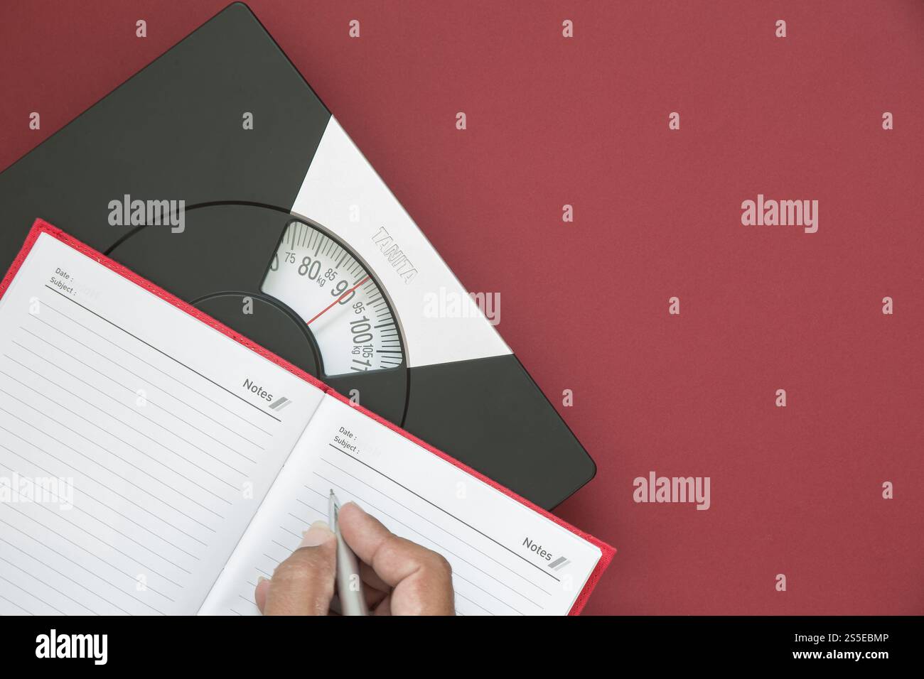 Top view notebook with weight scale Stock Photo - Alamy