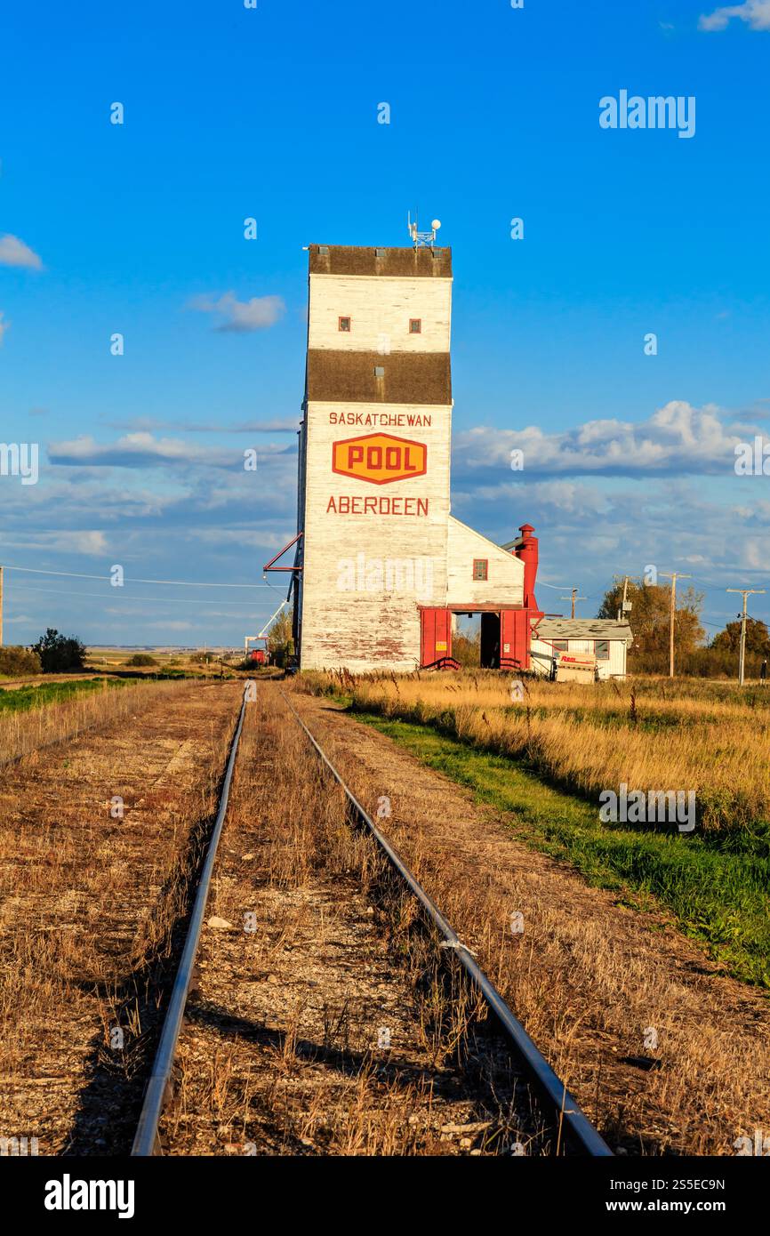A grain silo with a sign that says Pool Aberdeen. The silo is tall and ...