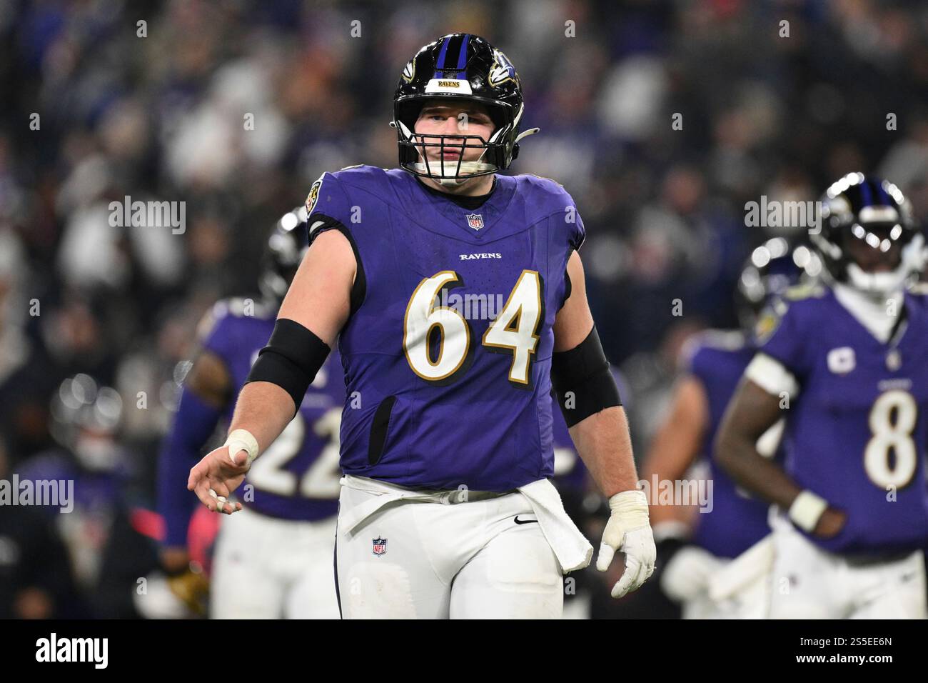 Baltimore Ravens center Tyler Linderbaum (64) walks onto the field ...