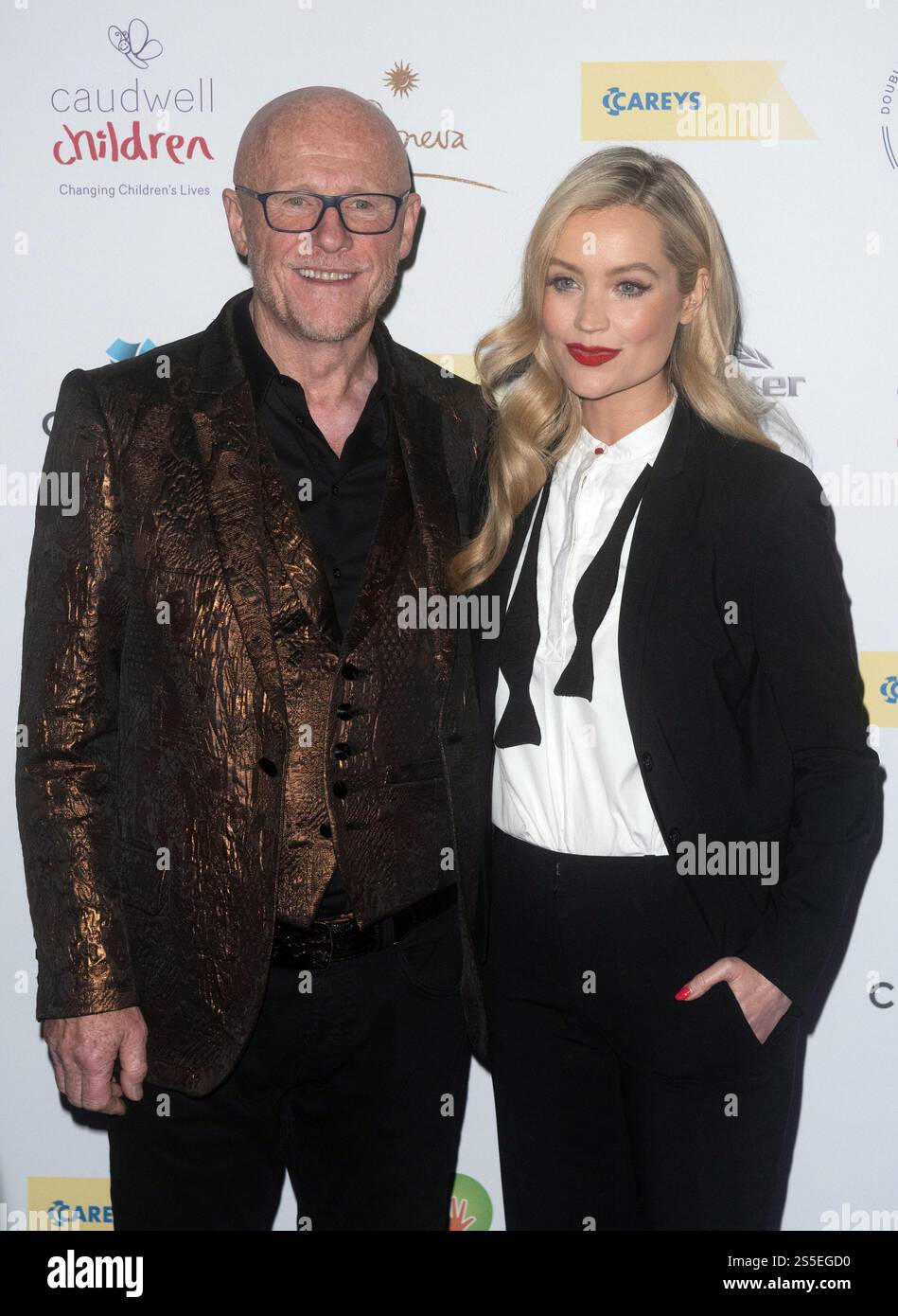 John Caudwell and Laura Whitmore attends the Caudwell Children ...