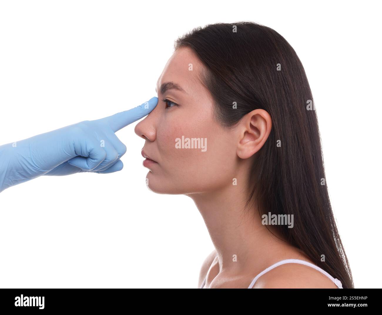 Doctor checking patient's nose before plastic surgery operation on ...