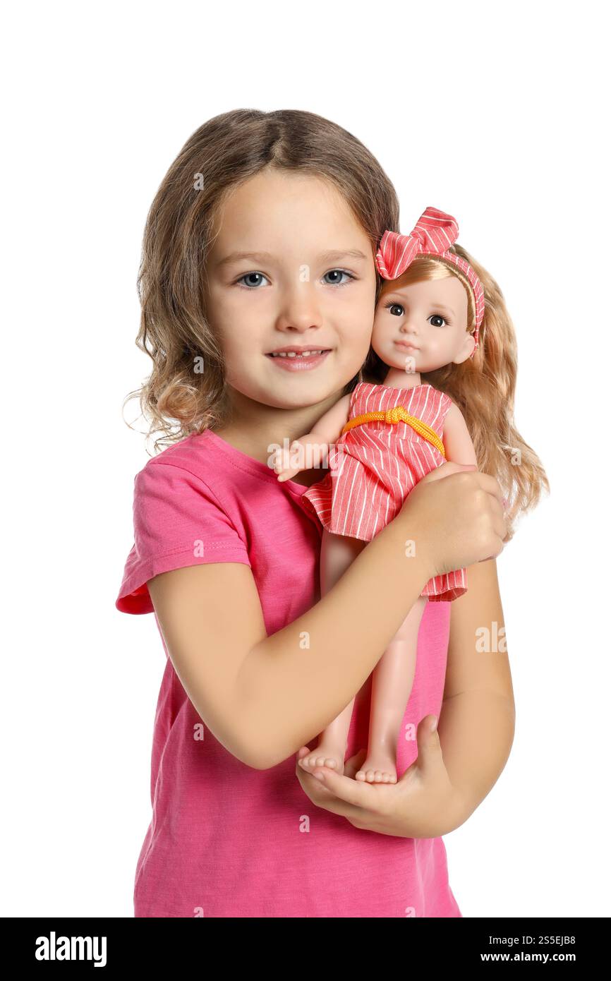 Cute little girl holding doll on white background Stock Photo - Alamy