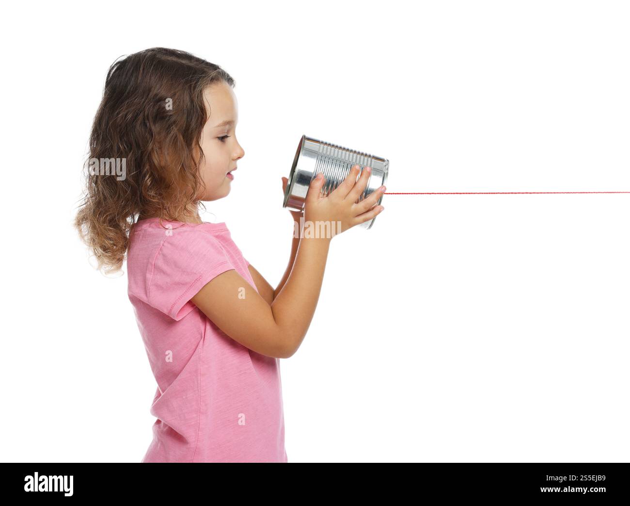 Girl using tin can telephone on white background Stock Photo - Alamy