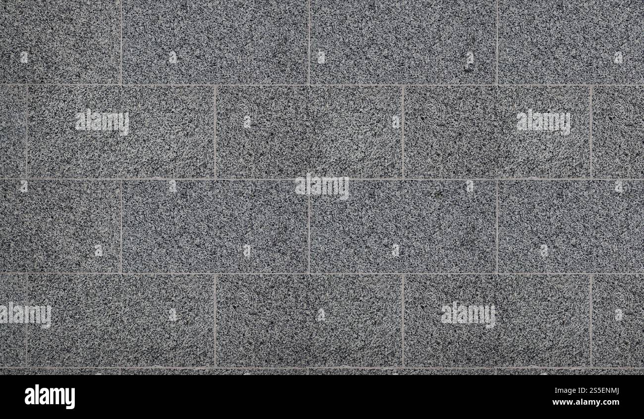 The texture of solid granite tiles. Hard and slippery gray granite ...