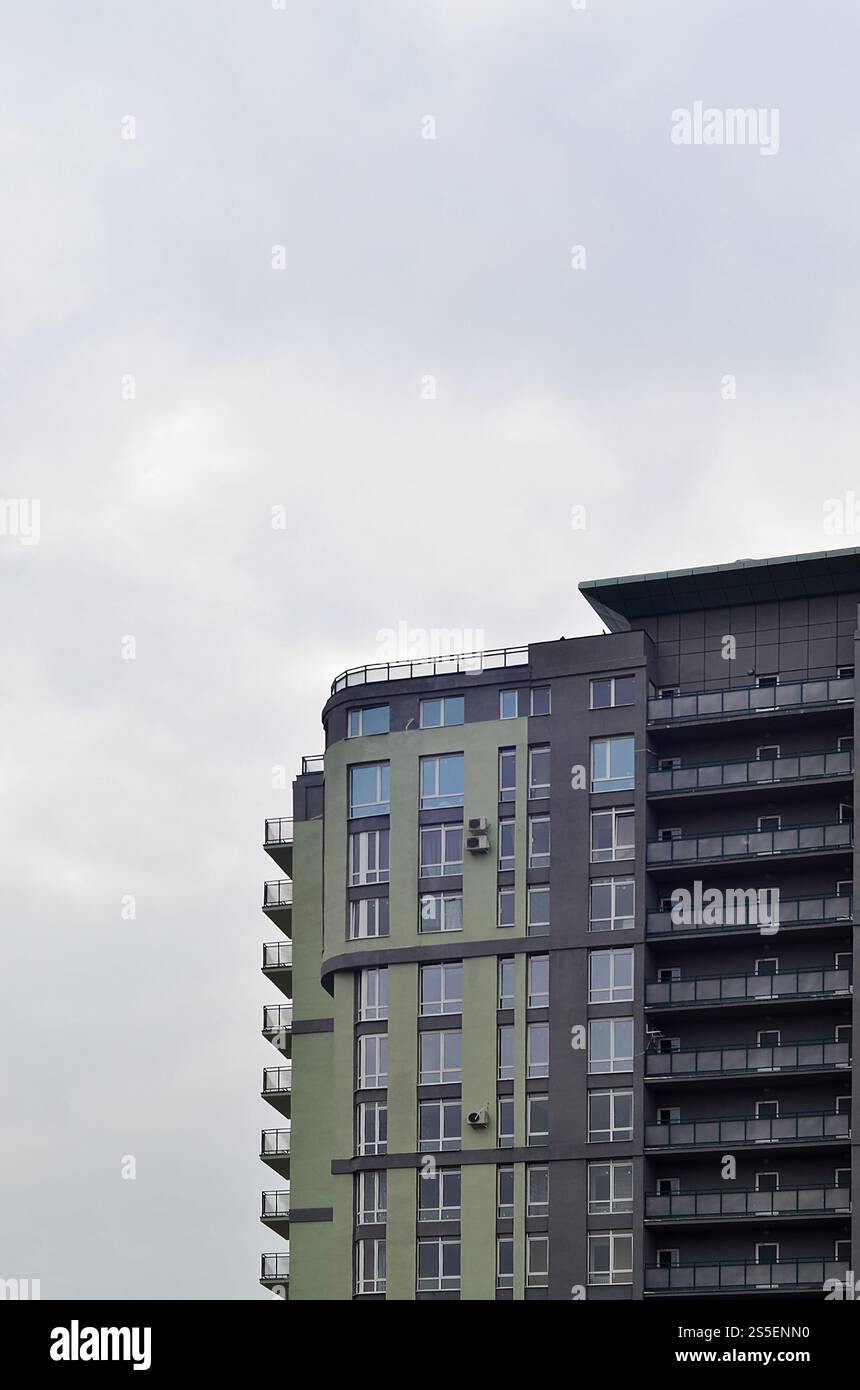 Multi-story office building beige color with lots of glass windows on a ...