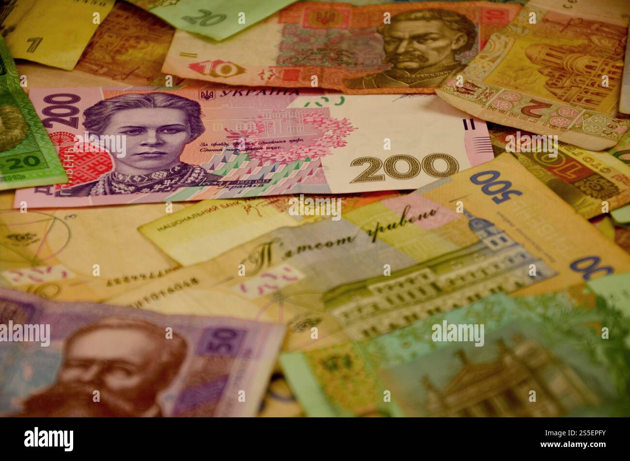 The background image of a pile of Ukrainian banknotes of different ...