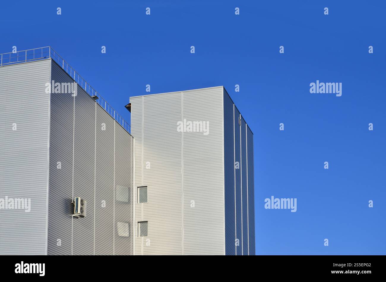 Photo of industrial high-rise building with perfect quality siding in ...