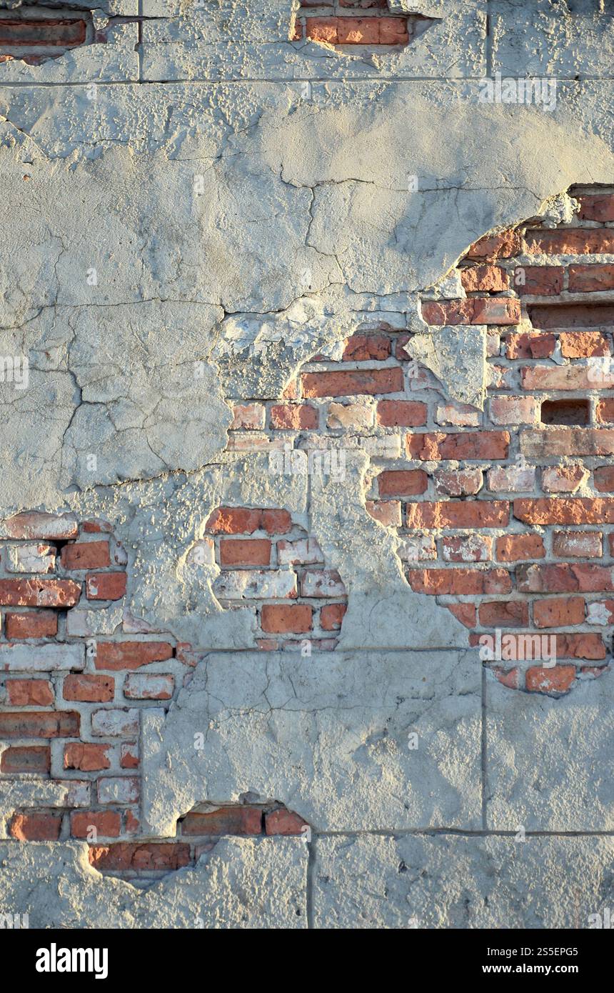 Weathered stained brick wall with cracked cement tension. Brick wall ...