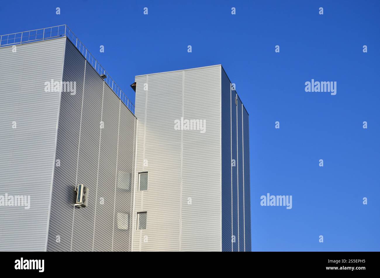 Photo of industrial high-rise building with perfect quality siding in ...