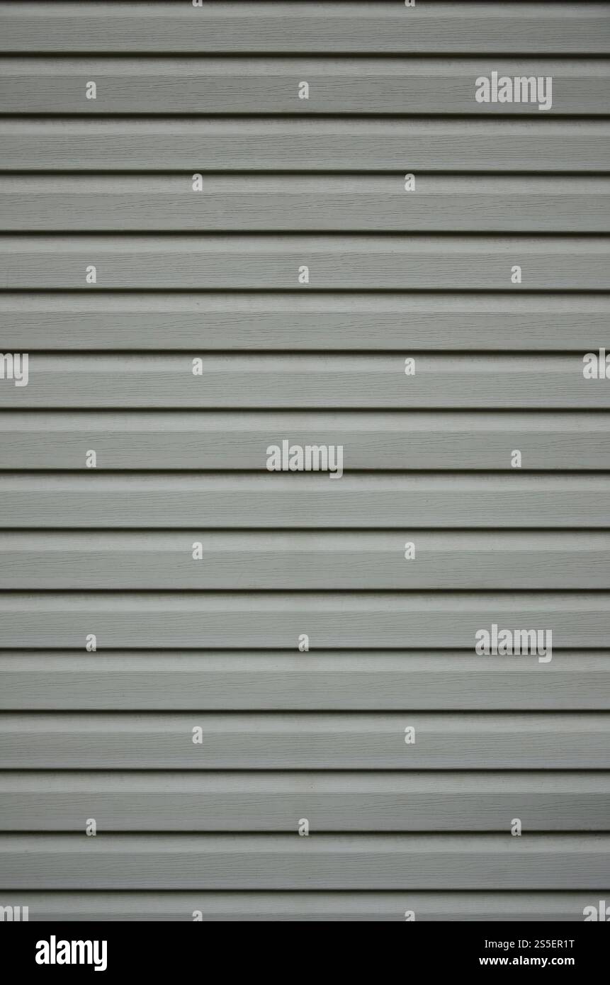 Siding, plastic panels texture closeup in the daytime outdoors. Plastic ...